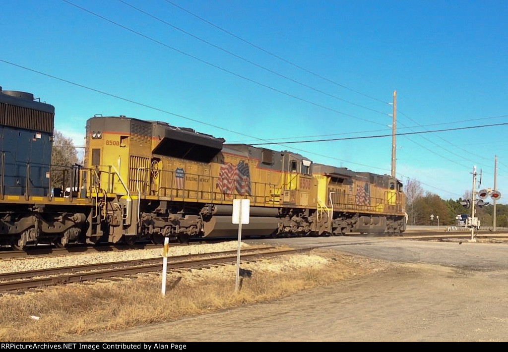 UP 6000, 8508, and CSX SD40-2 8066 roll NB mixed freight across the Tatum Road crossing